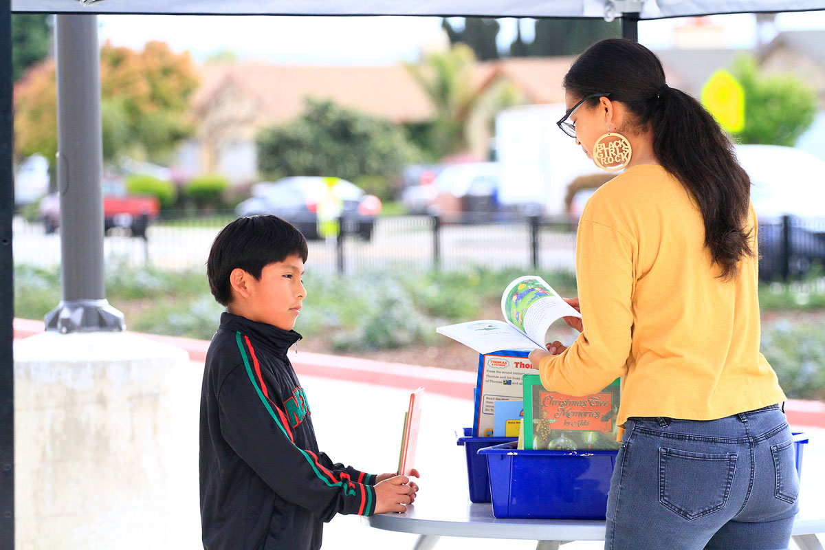 Greenfield teacher hands out books to area youth - Greenfield News ...
